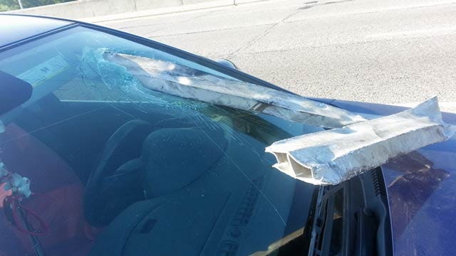 Driver Not Injured When Piece Of Metal Hits Car's Windshield On I-244