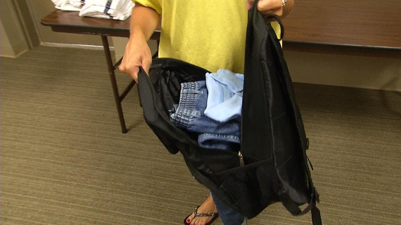 Volunteers Fill Backpacks With School Supplies For Children In Need